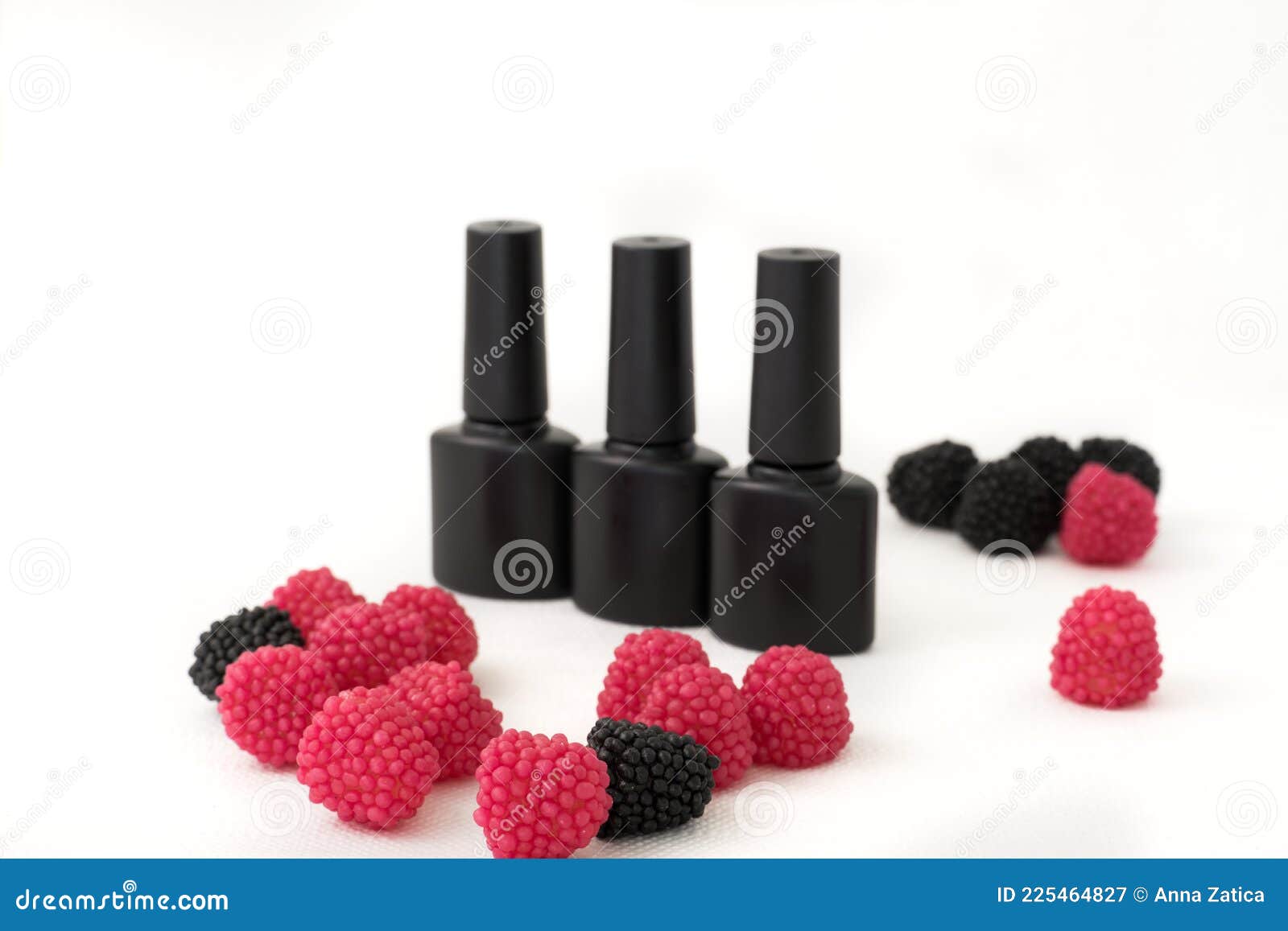 Nail Polish in Black Jars and Raspberry-shaped Candies in Red and Black ...