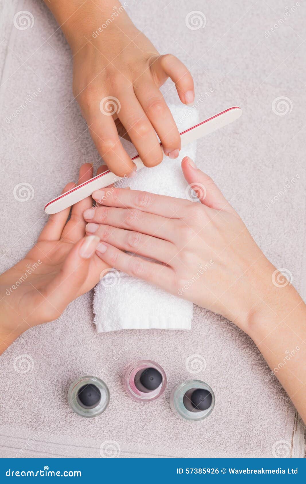 Nail Technician Giving Customer a Manicure Stock Photo - Image of ...