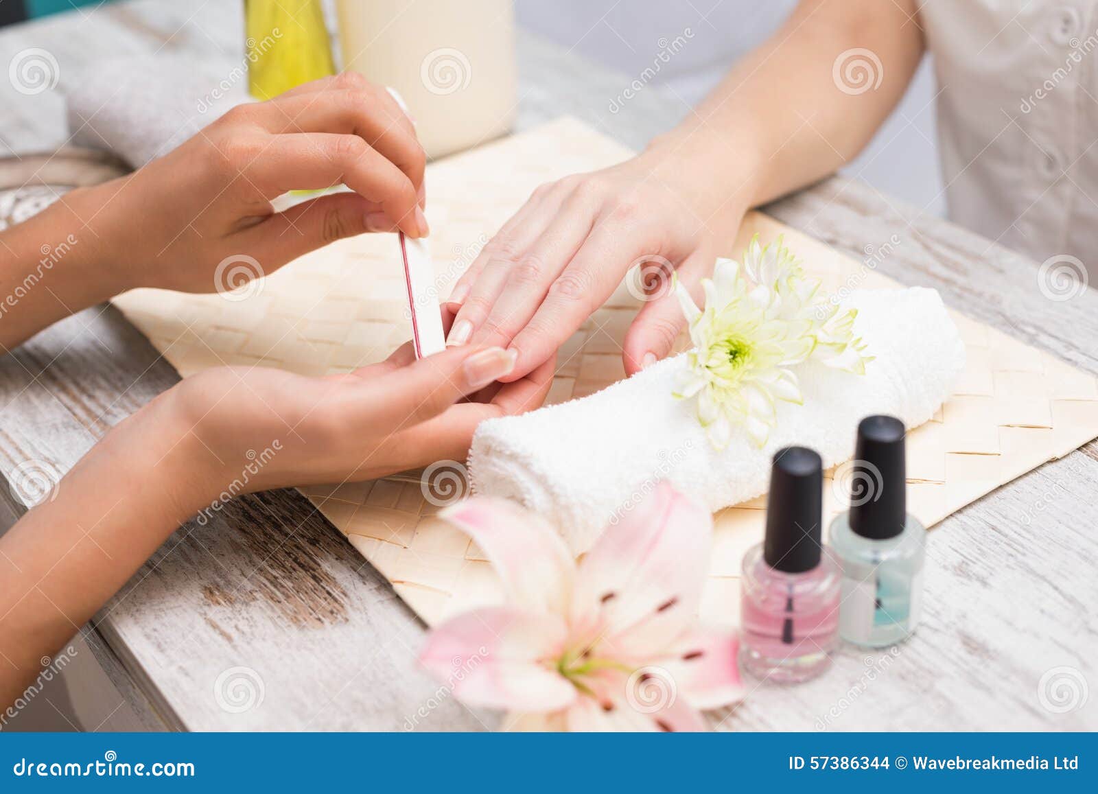 Nail Technician Giving Customer a Manicure Stock Photo - Image of ...