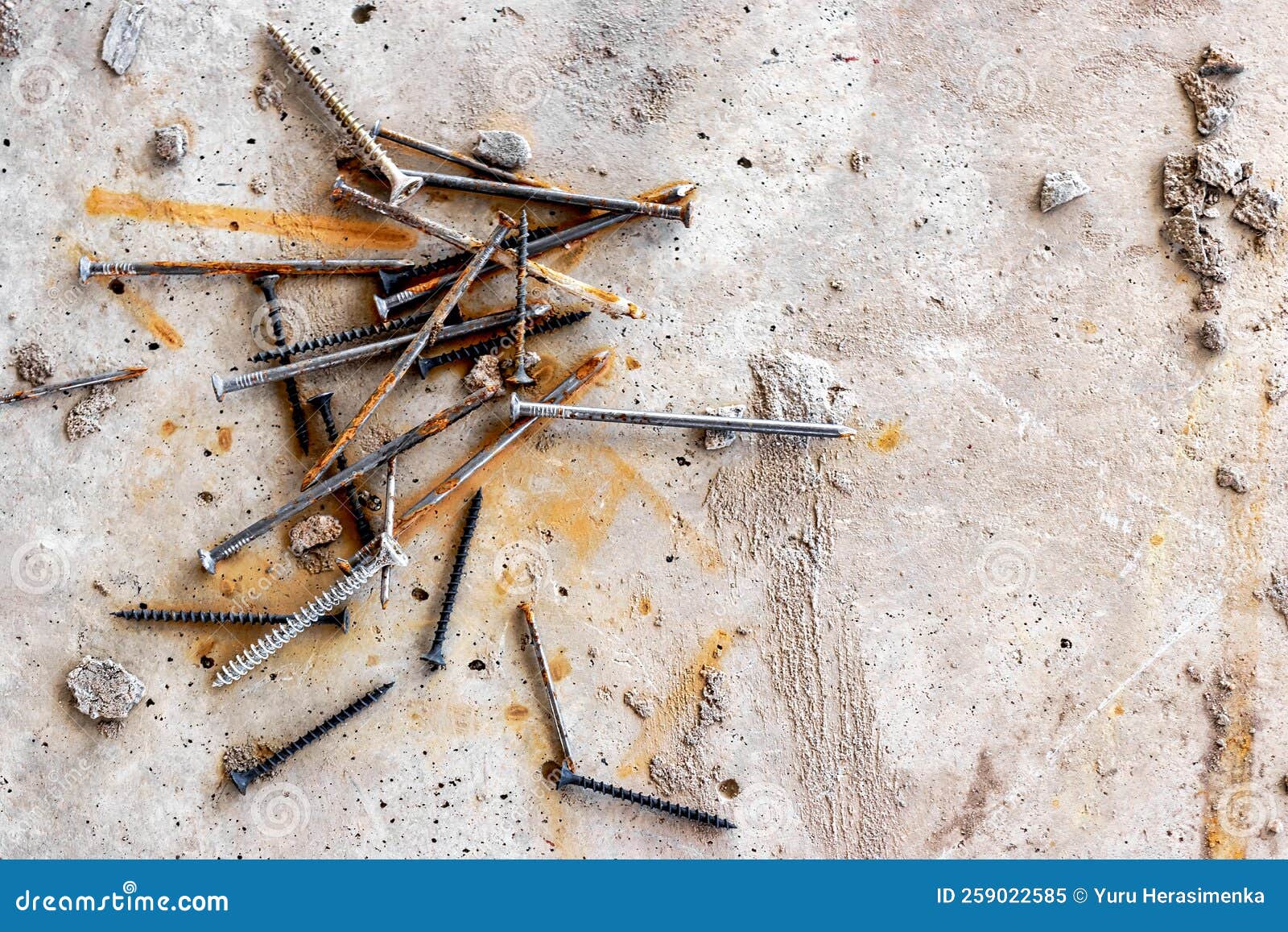Nails and Self-tapping Screws on Concrete at a Construction Site. Rust ...
