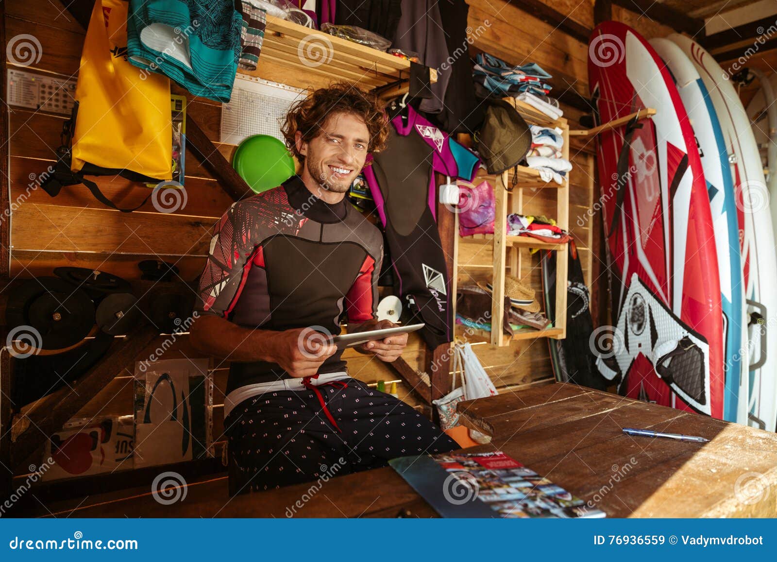 Nan in Swimsuit Using Tablet while Sitting in Shack Stock Image - Image ...