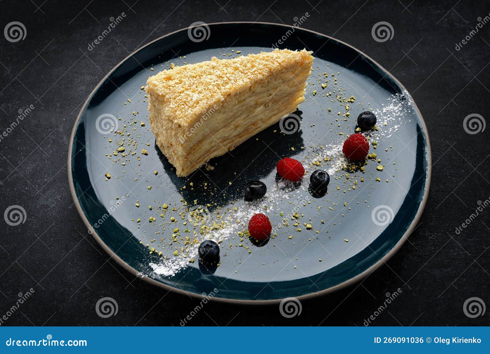 Napoleon Cake, on a Dark Plate with Berries, on Dark Concrete Stock ...
