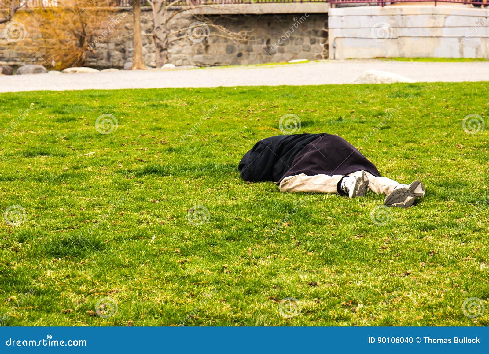 Napping Individual at Local Park Stock Photo - Image of plugs, laying ...