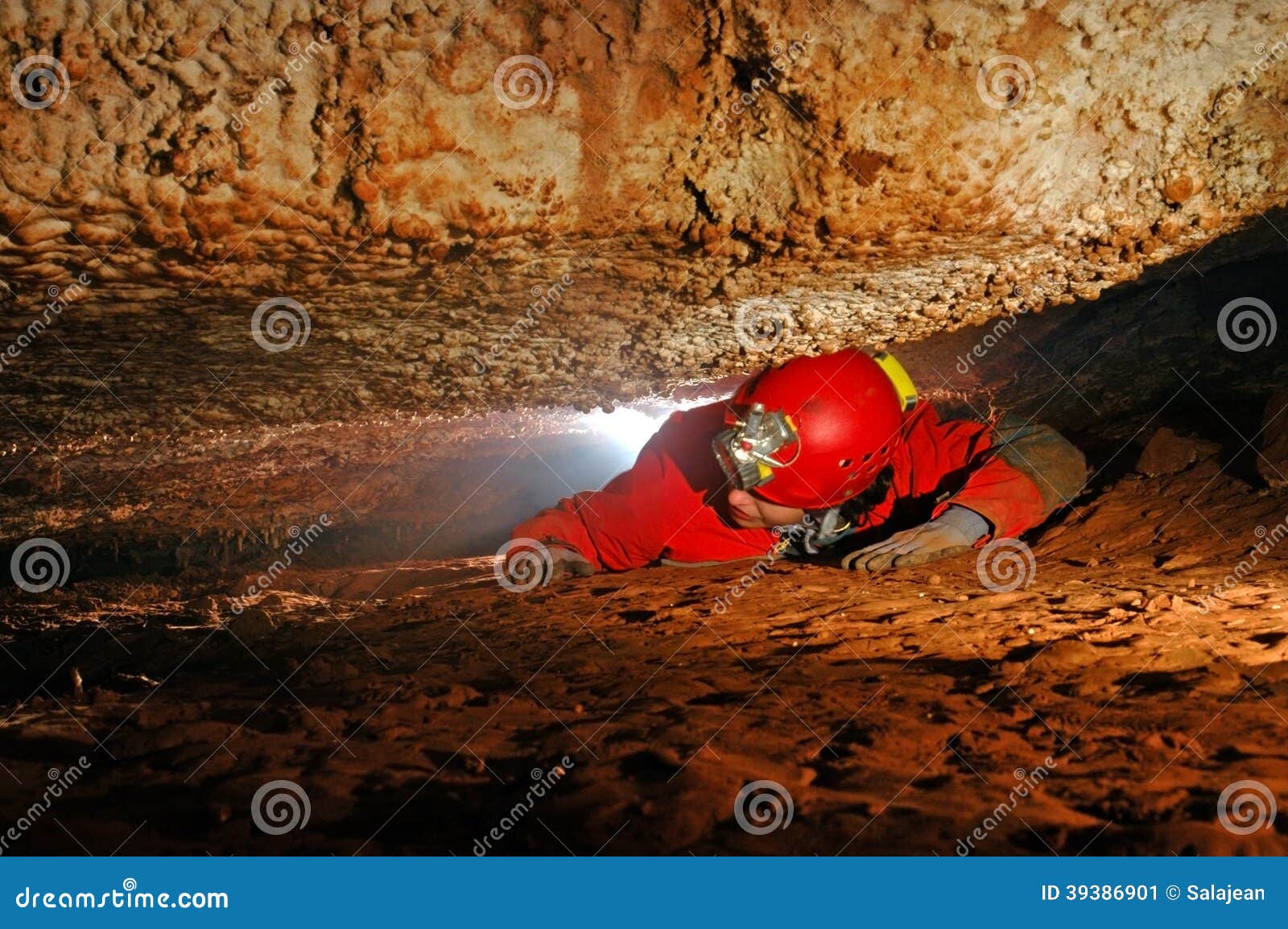 Narrow Cave Passage with a Cave Explorer Stock Image - Image of cave ...