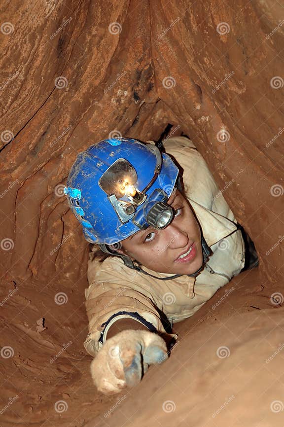 Narrow Cave Passage with Caver Stock Photo - Image of cavern, earth ...