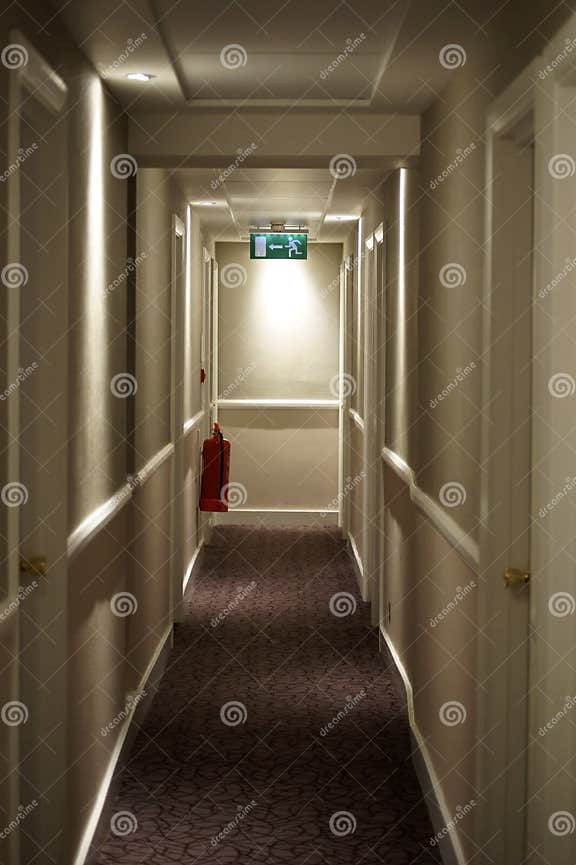Narrow Hallway with Escape Route Stock Photo - Image of hall, sign ...