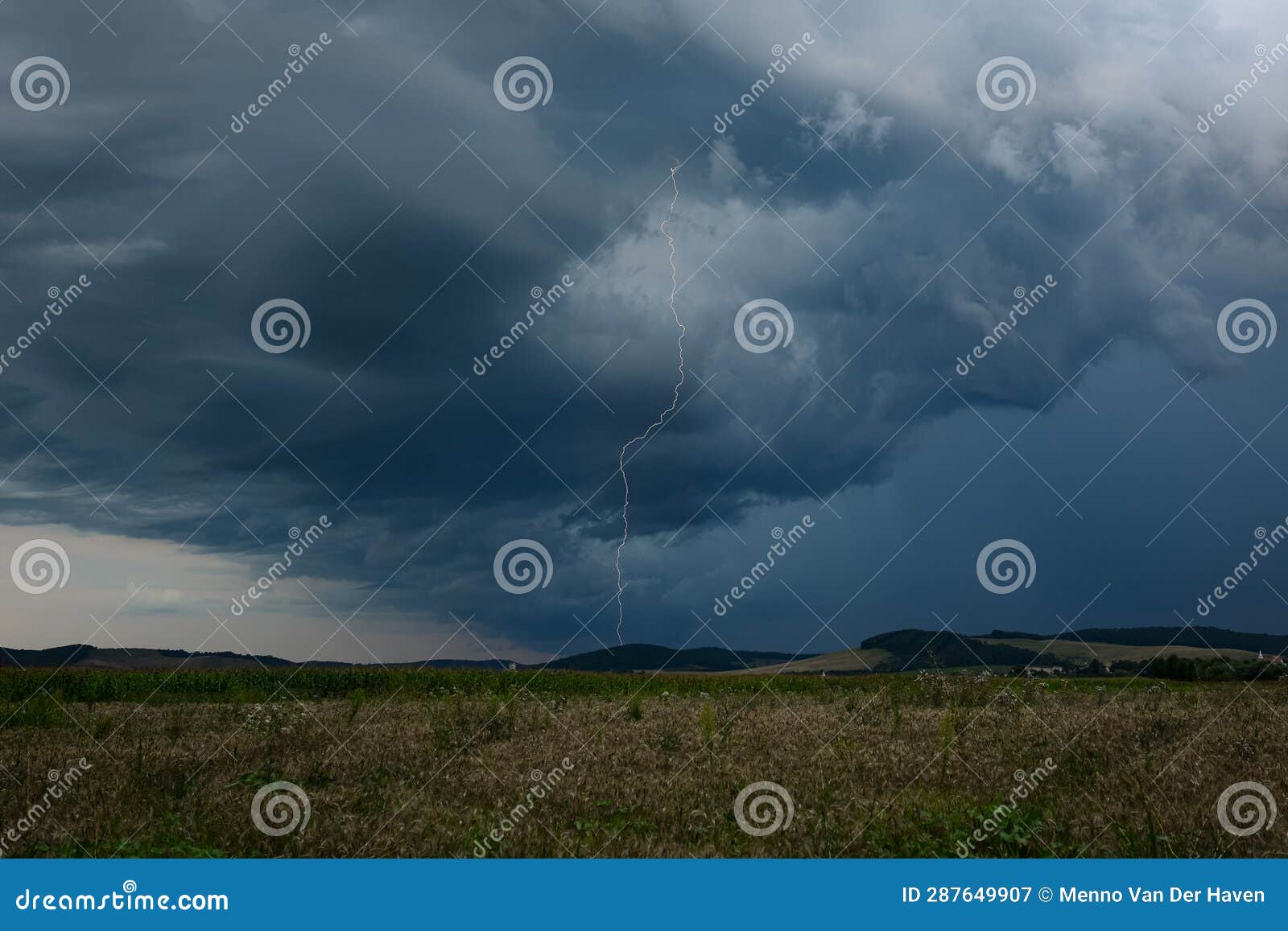 Narrow Long Vertical Lightning Bolt Shoots Out of a Dark Thundercloud ...