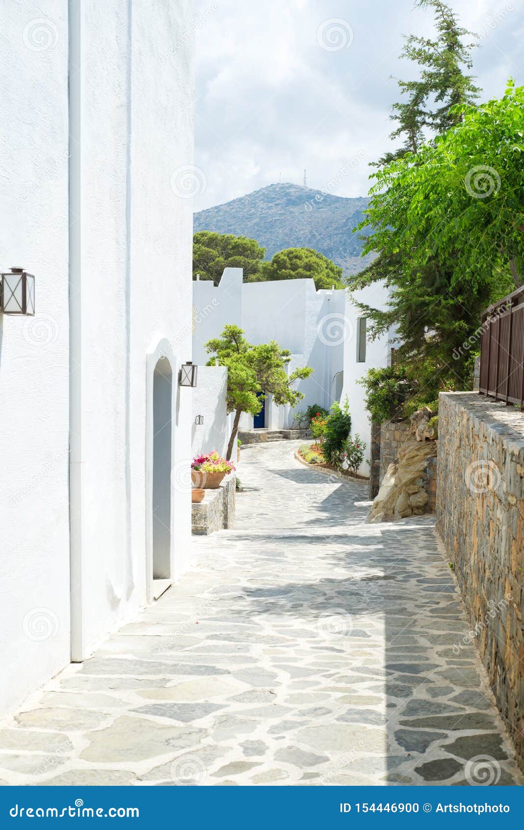 Narrow Passage with White Buildings and Trees Stock Photo - Image of ...
