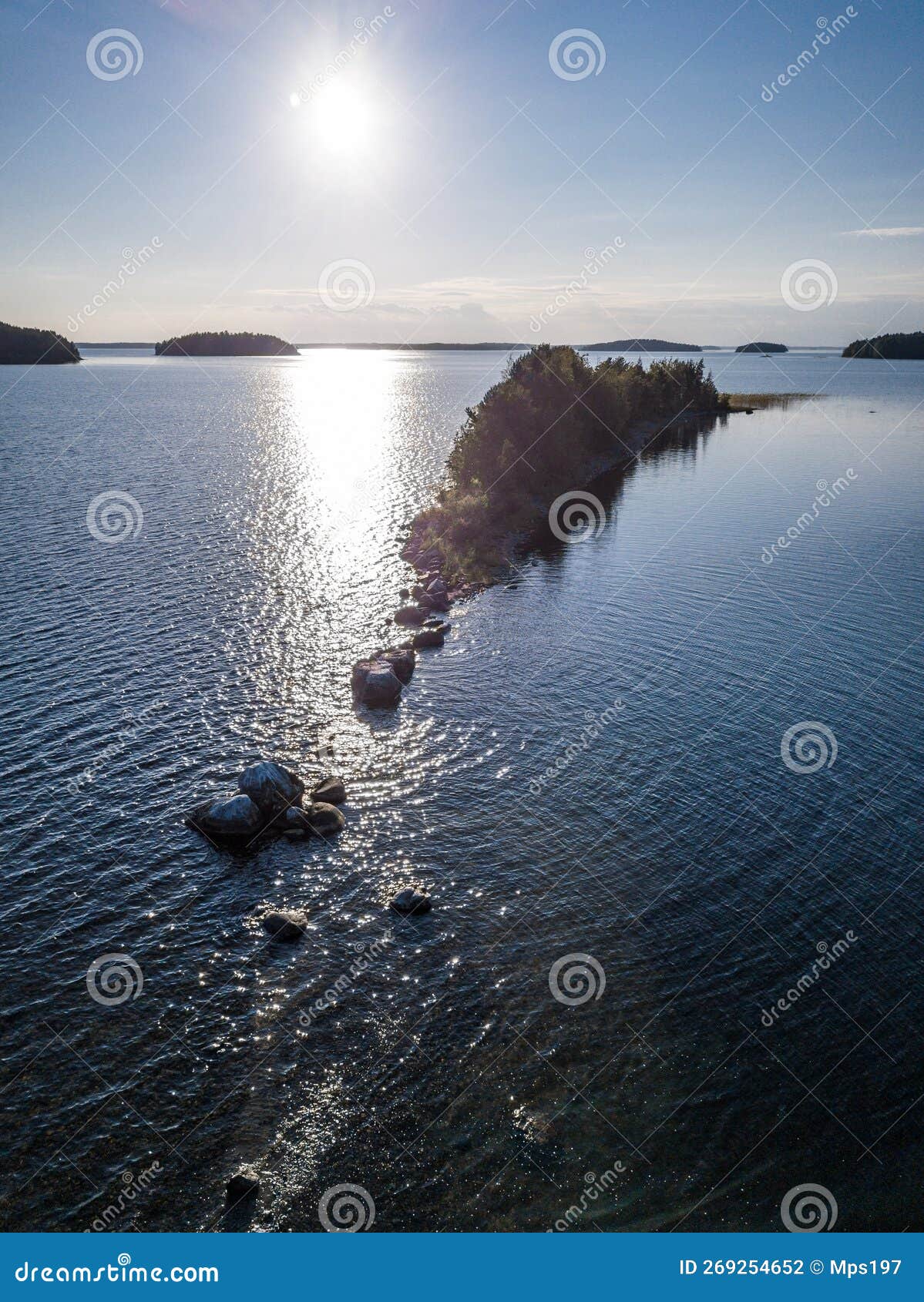 Narrow Ridge Island with Trees Stock Photo - Image of ridge, narrow ...