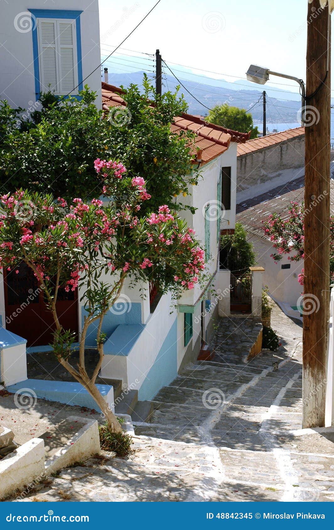 Narrow street Greek stock image. Image of outdoors, home - 48842345