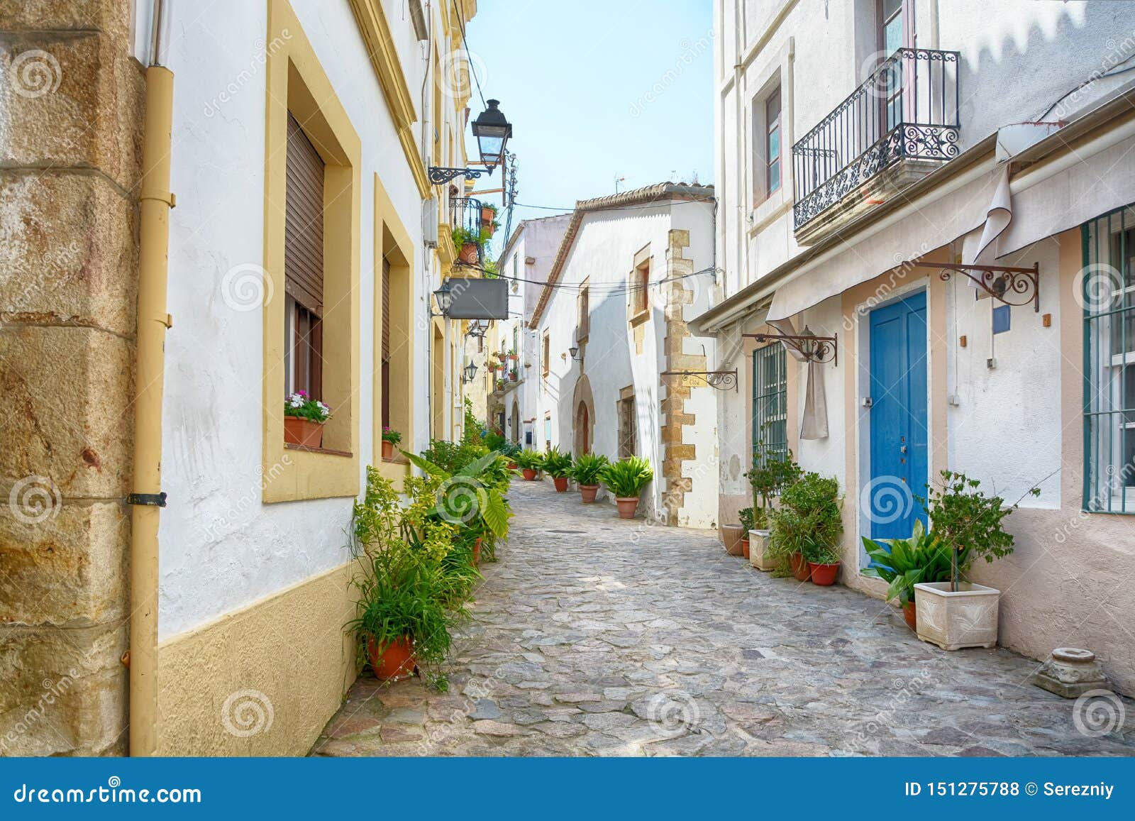 Narrow street in old city stock photo. Image of living - 151275788