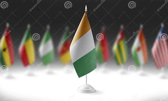 The National Flag Of The Cote Divoire On The Background Of Flags Of