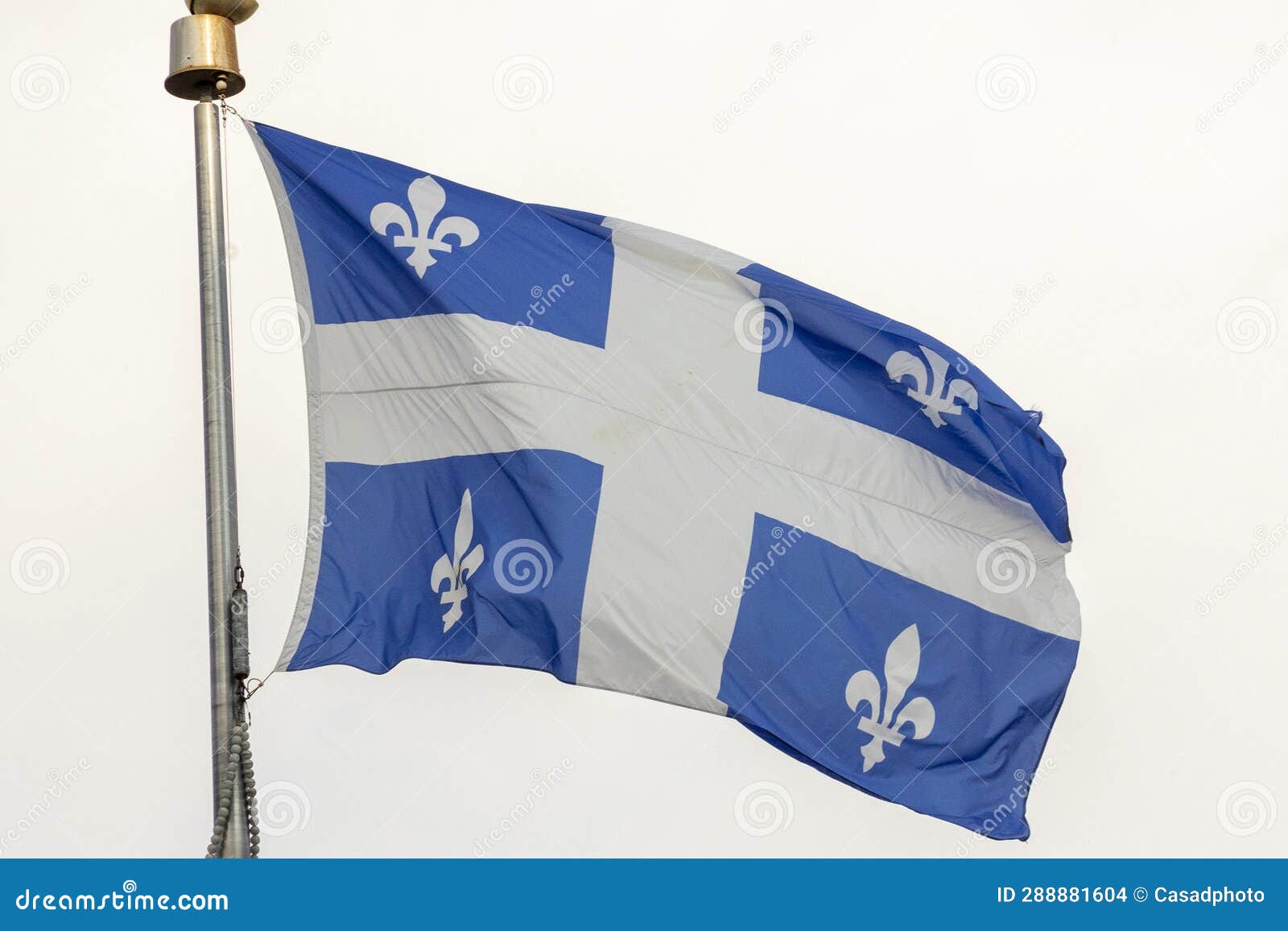 National Flag of Quebec on a Flagpole Flutering on Wind Stock Photo ...