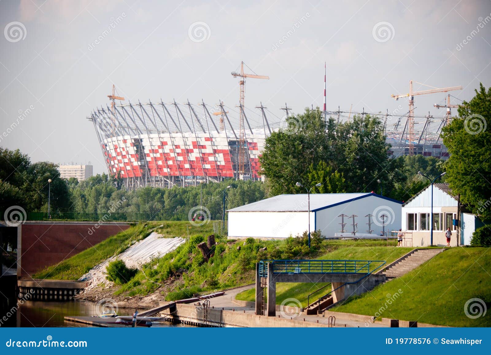 Stadium Construction. Construction Equipment And Workers On The ...