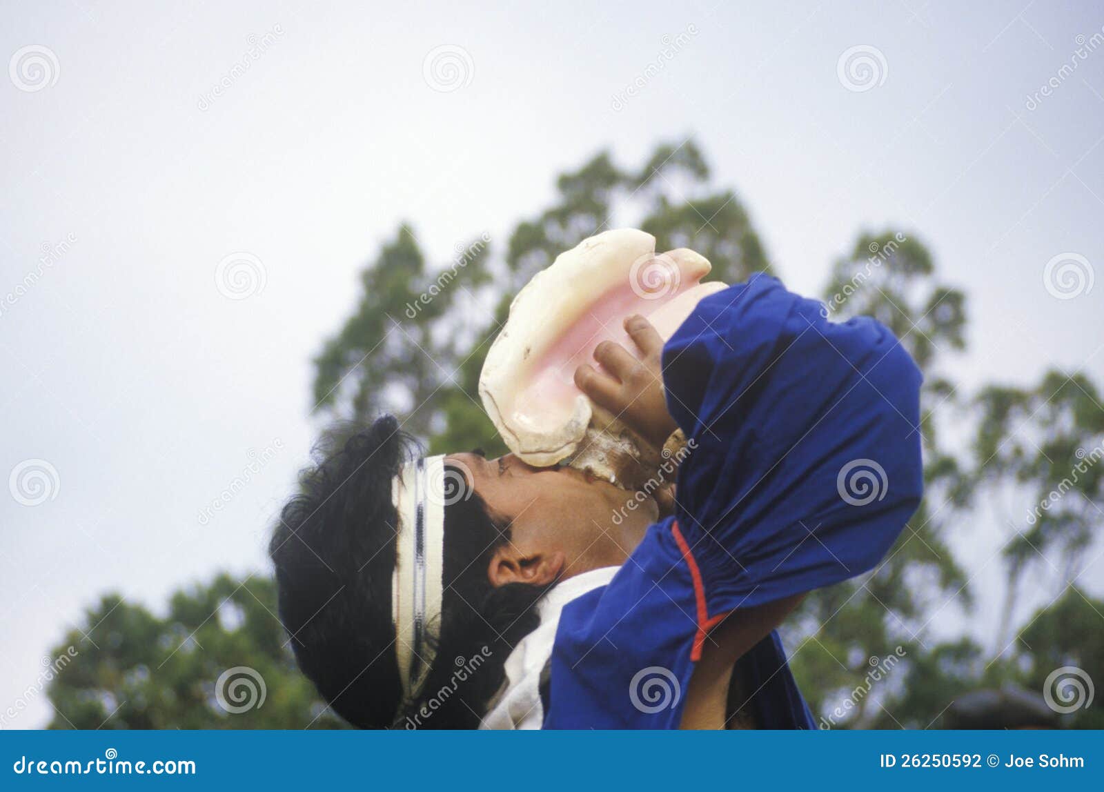 Native American Blowing into Conch Shell Editorial Photography - Image ...