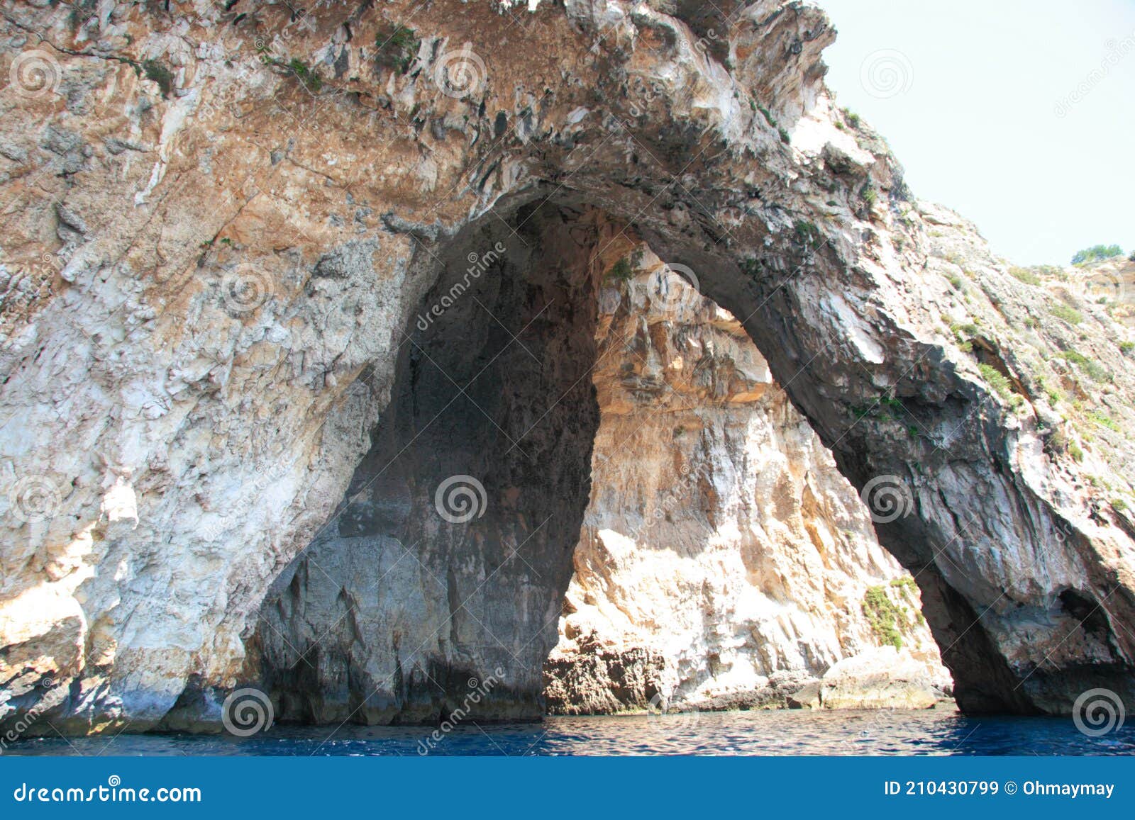 The Natural Arch of Blue Grotto of Malta Stock Image - Image of boat ...