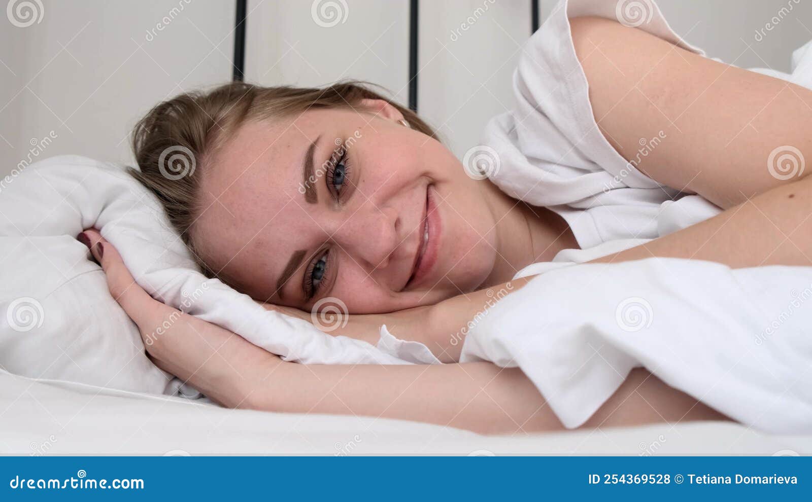 Natural Beauty Young Seductive Smiling Woman Looking Into Camera Lying