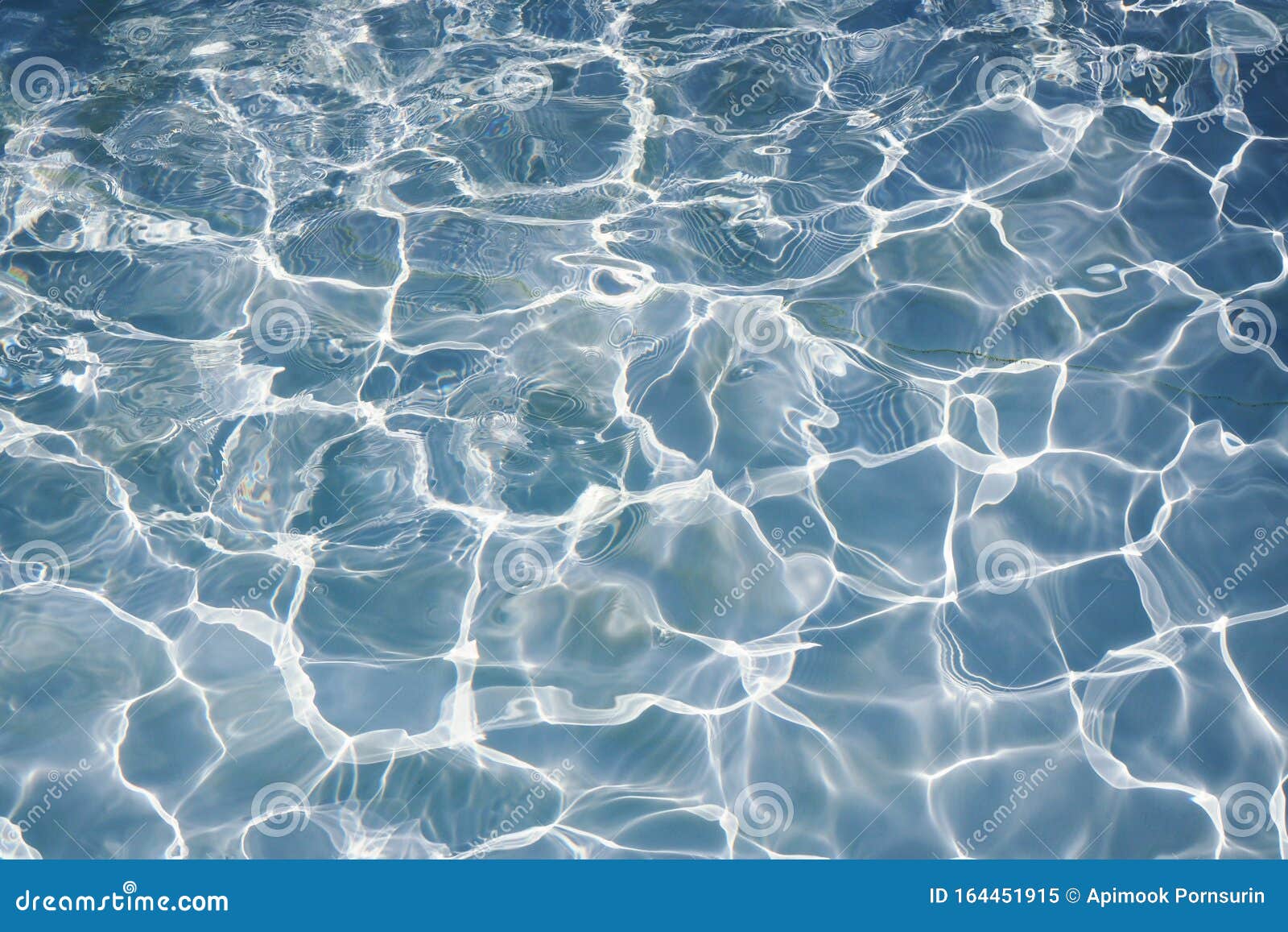 Natural Blue Water Surface with Bright Sun Light Reflections. Blue ...