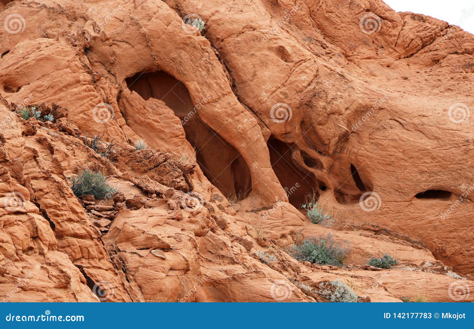 Natural cave in red rock stock image. Image of arch - 142177783
