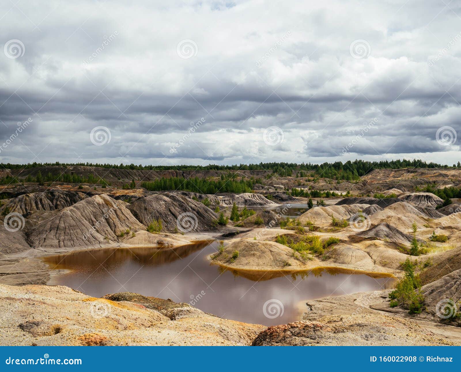 Natural Clay Quarry. Red Lake because of the Clay Stock Photo - Image ...