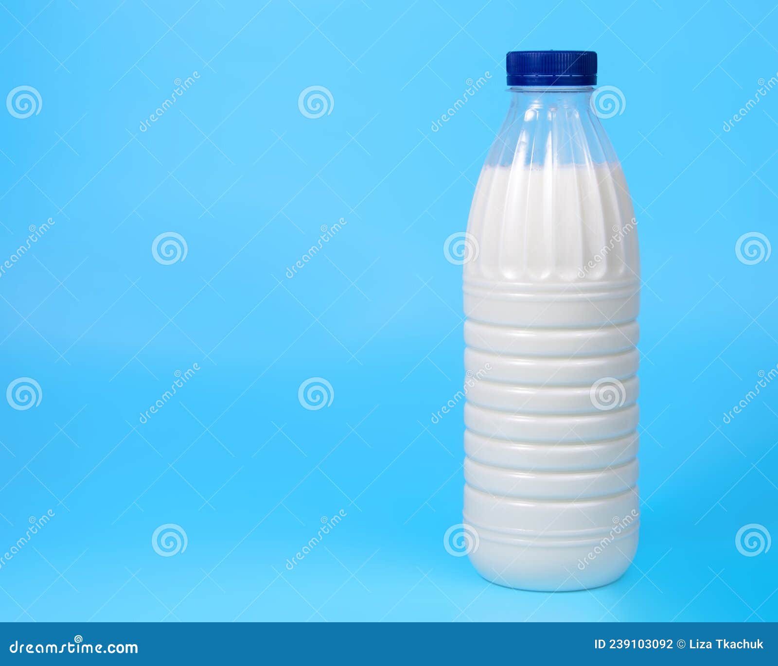Natural Fresh Milk Bottle on Blue Background Close Up Stock Photo ...