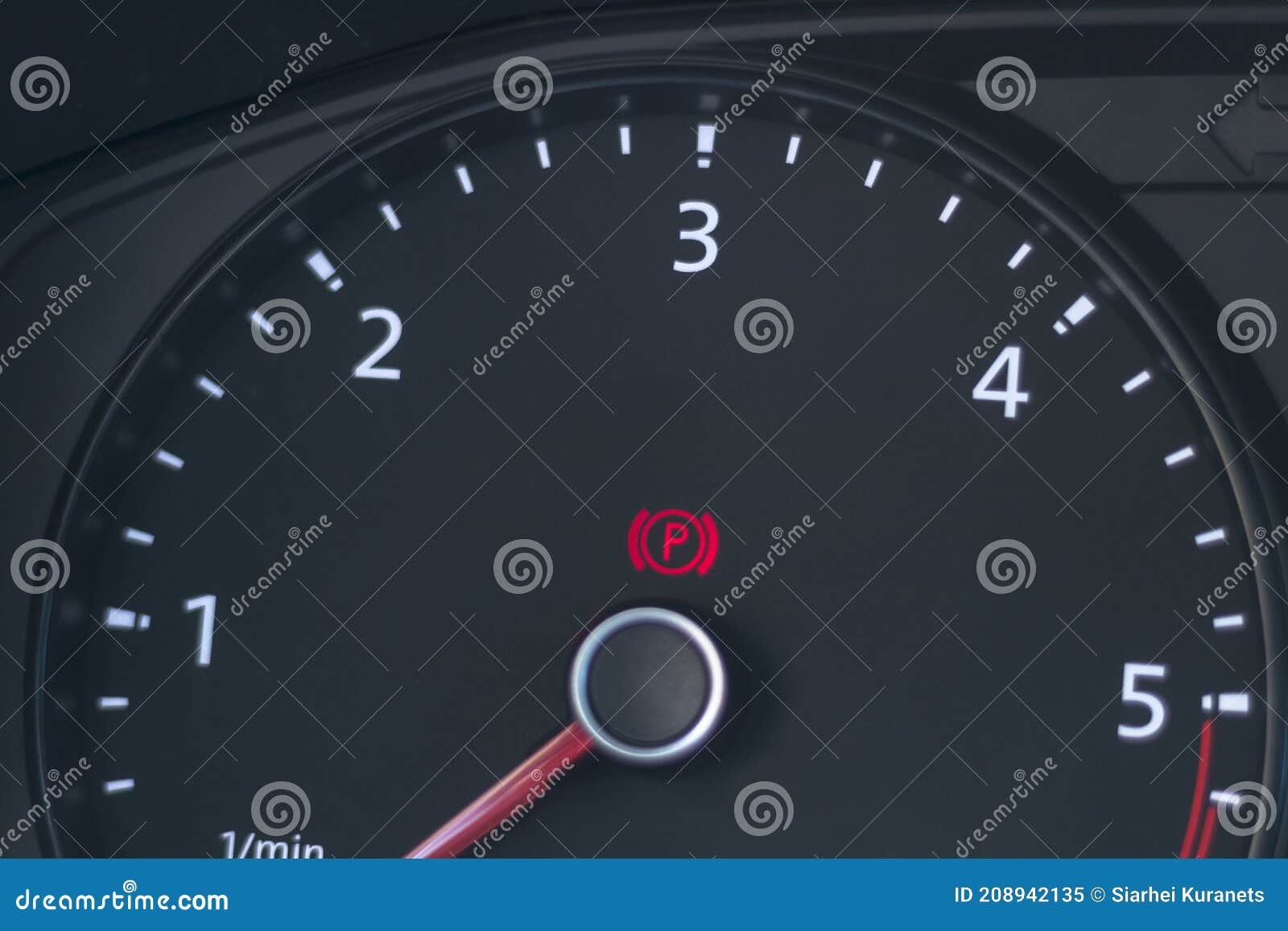 Natural Light. the Dashboard of the Car. the Handbrake Indicator is on ...