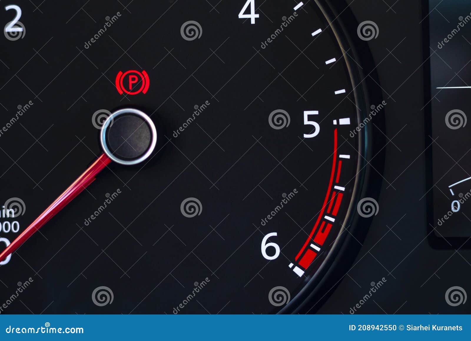 Natural Light. the Dashboard of the Car. the Handbrake Indicator is on ...