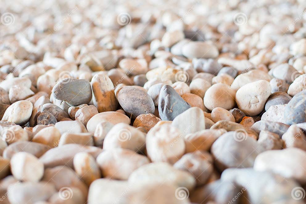 Natural Pebbles Form in Dense Brown Tones Stock Photo - Image of ...