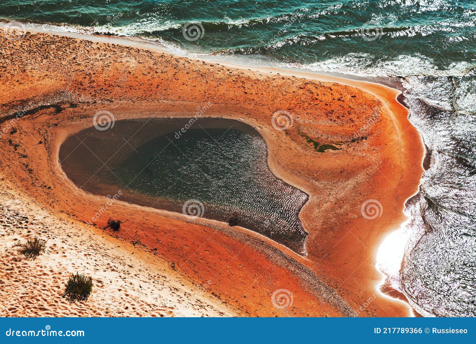 Natural pool on the beach stock photo. Image of extreme - 217789366