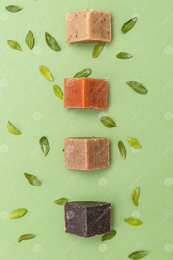 Natural Soap Triangular Pieces on Green Background. Vertical Format ...