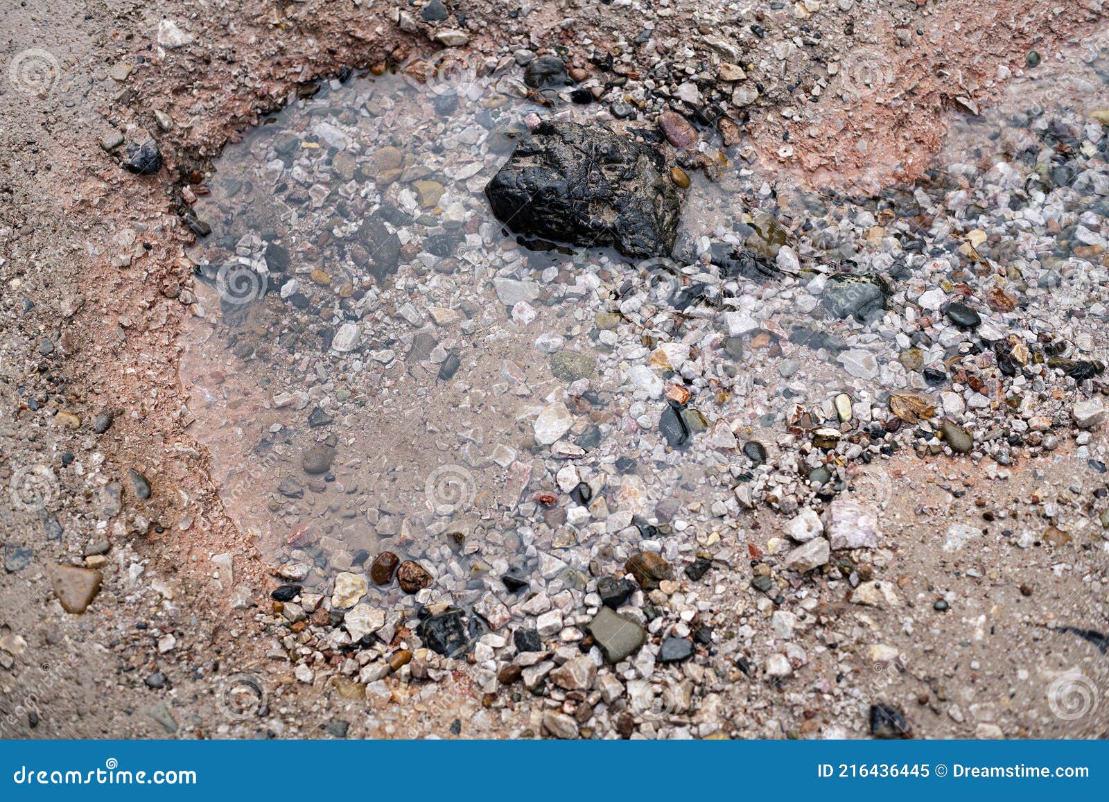 Natural Spring of Fresh Water from a Stone Embankment. Stock Image ...