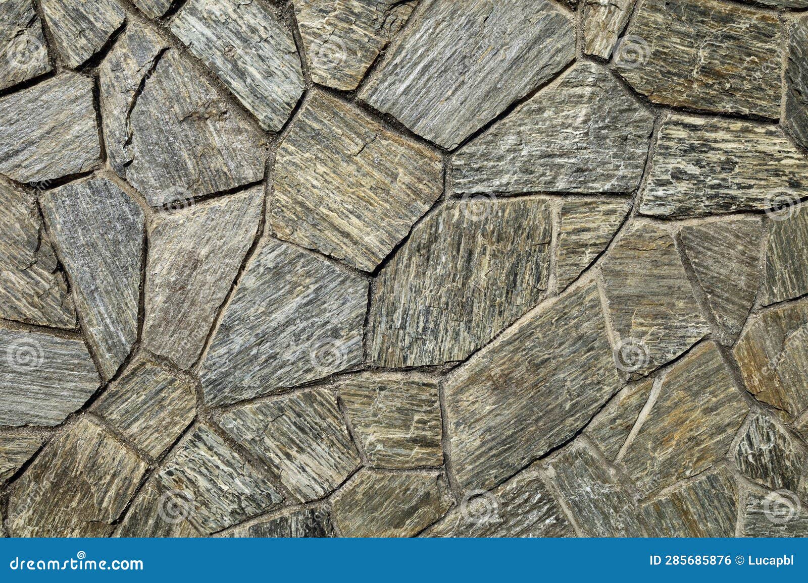 Natural Stone Wall Coating with Rocks of Different Sizes Arranged ...