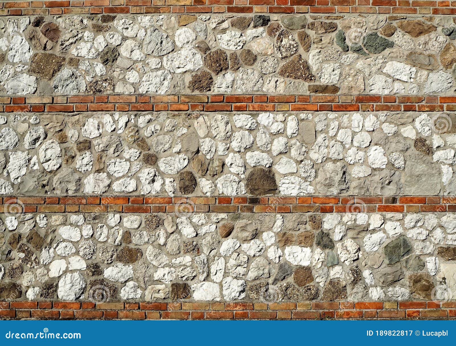 Natural Stone Wall Divided in Three Parts from Horizontal Strips of ...