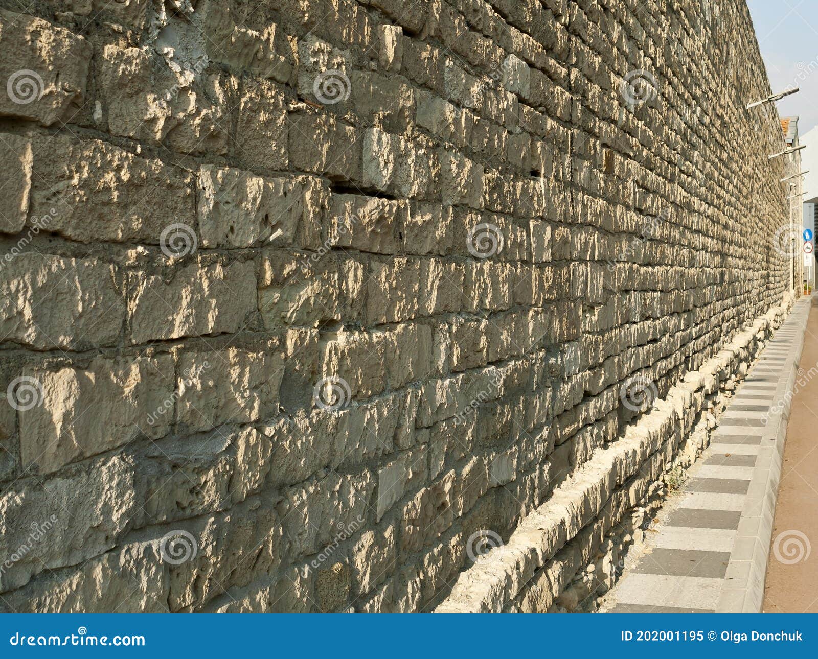 Natural Stone Wall in Sunlight, Angle View Stock Image - Image of stone ...