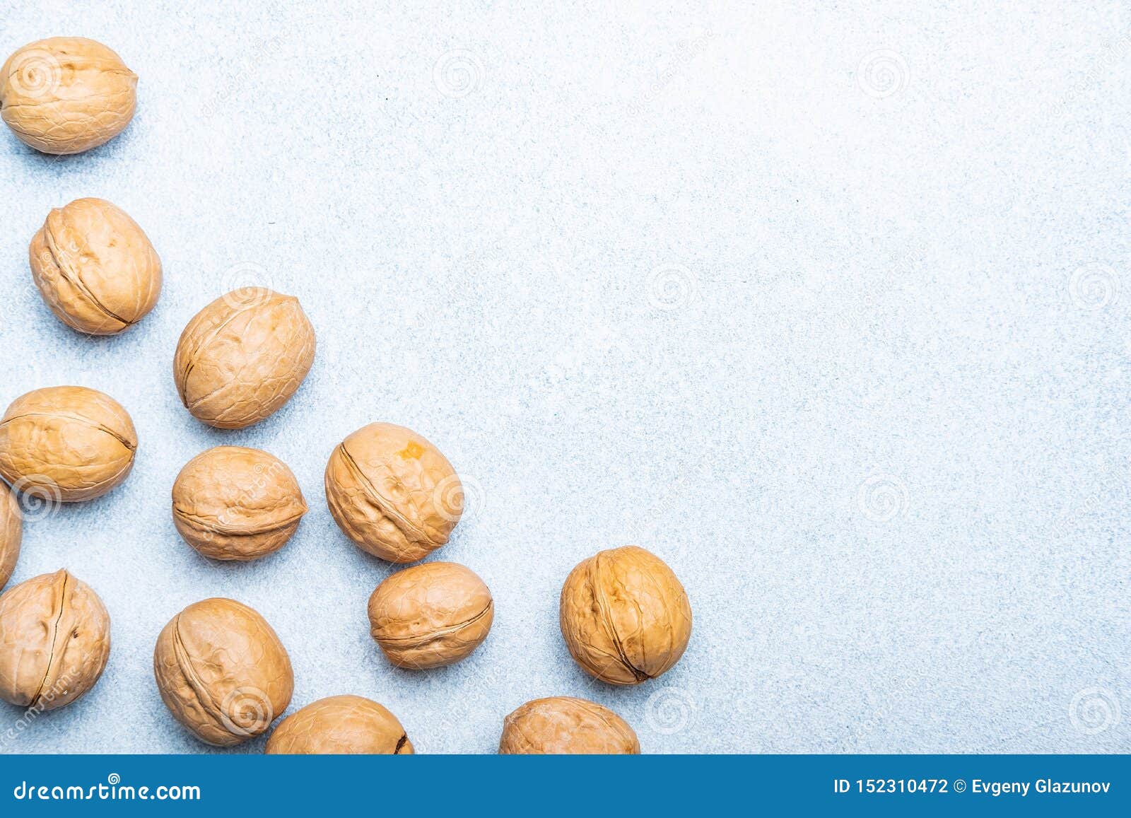 Natural Walnut in Shell on the Light Background Stock Photo - Image of ...