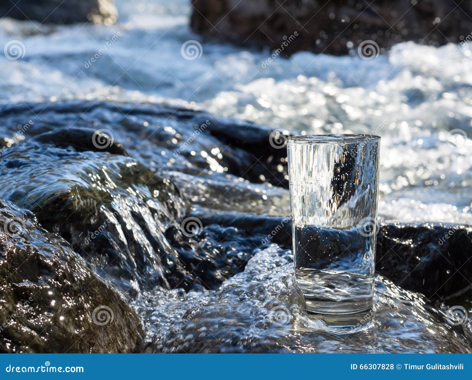 Natural water in a glass stock photo. Image of mountains - 66307828