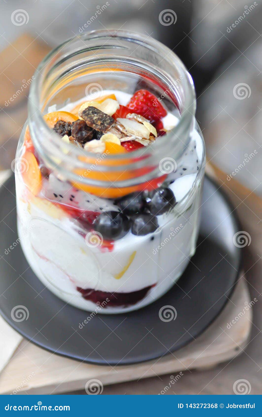 Yogurt with fruit topping stock photo. Image of peach - 143272368