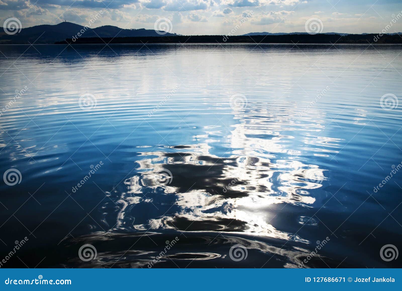 Abstract Reflection of a Cloud on a Lake Water Surface Stock Image ...
