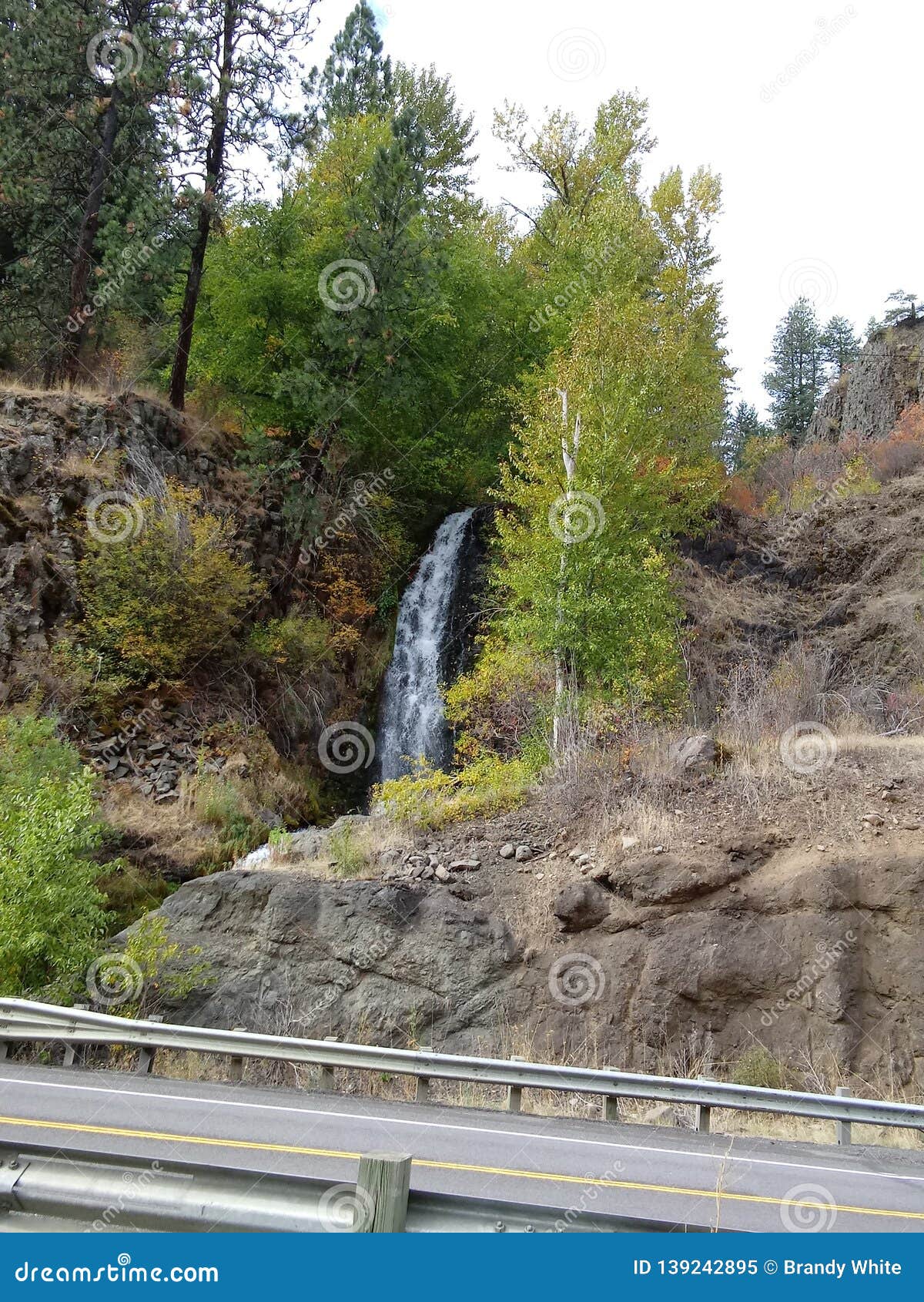 Roadside waterfall stock image. Image of roadside, people - 139242895