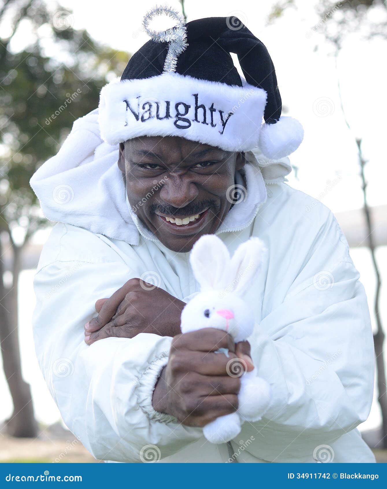 Naughty Santa Choking the Easter Bunny Stock Photo - Image of african ...