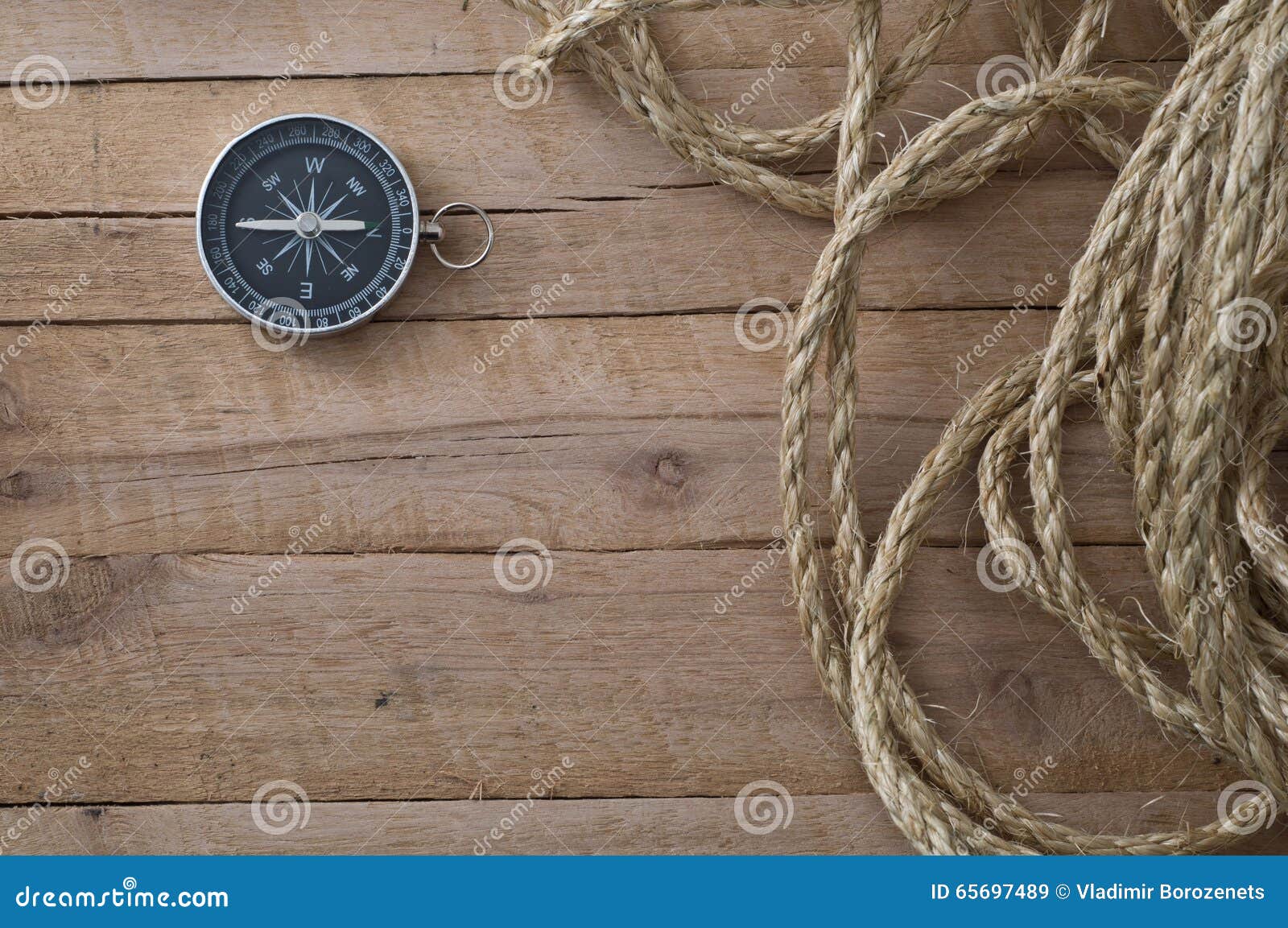 Nautical Rope and Compass on Wood Stock Image - Image of navigational ...