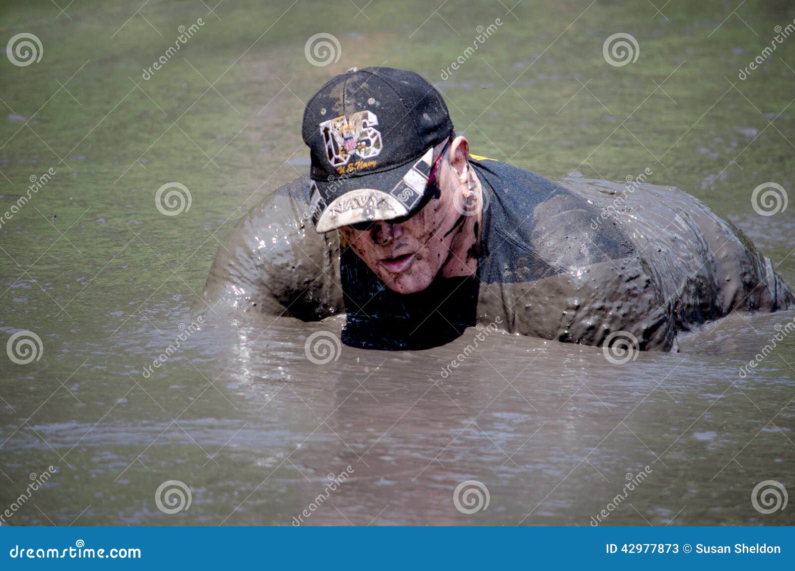 Navy man in the mud editorial stock photo. Image of training - 42977873