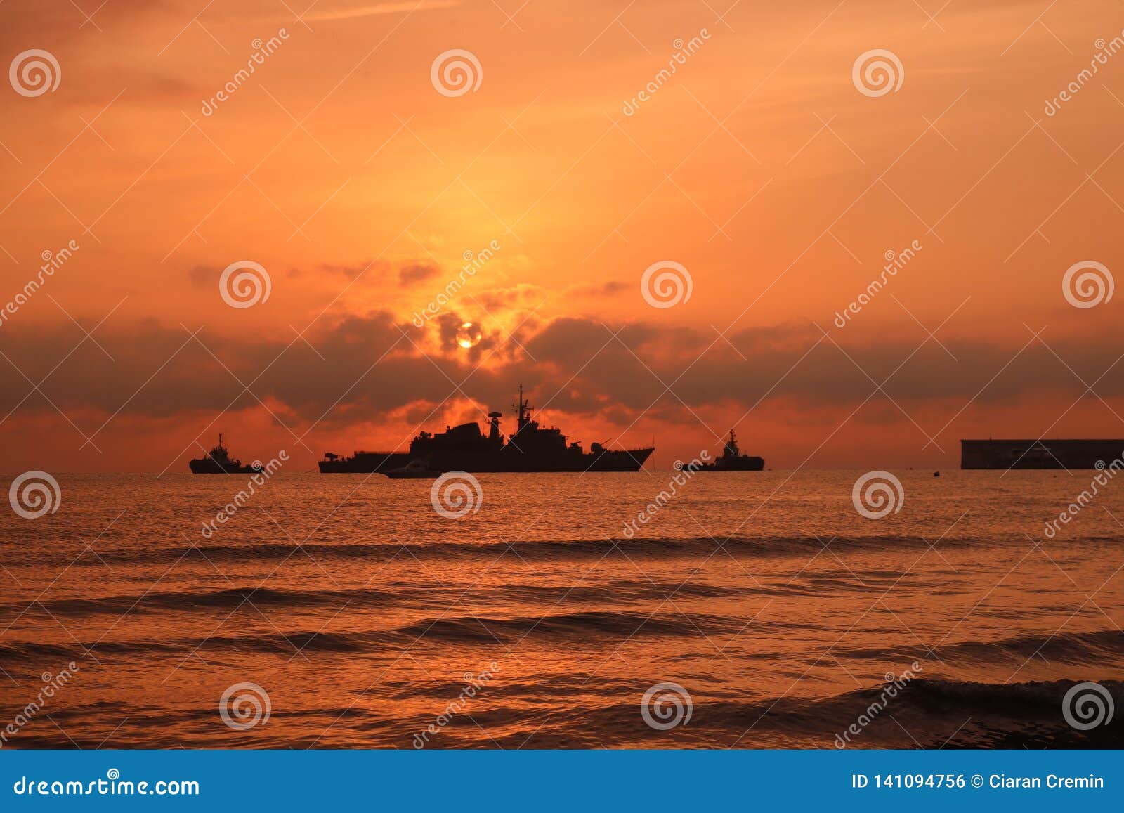 Navy ship at sea stock photo. Image of sunrise, sunset - 141094756
