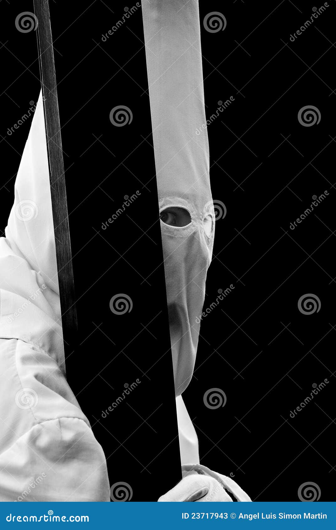Nazarene Wearing A Capirote And Carrying A Cross Stock Image ...