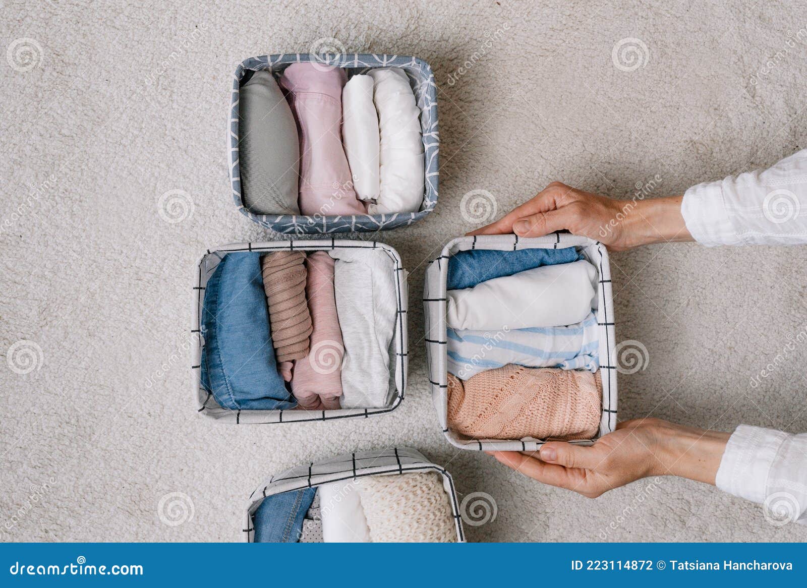 A Neat Housewife Puts Things in a Laundry Container during General ...