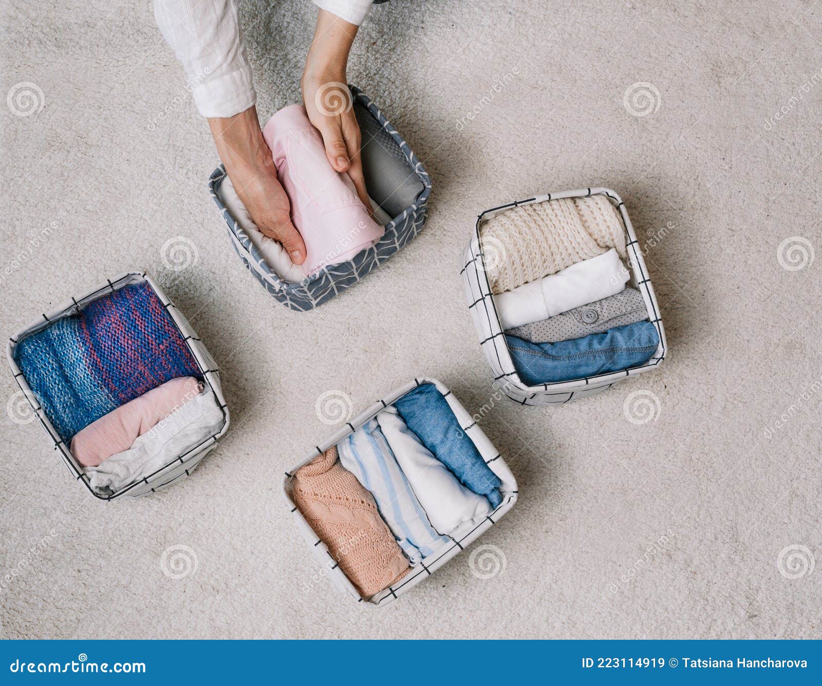 A Neat Housewife Puts Things in a Laundry Container during General ...