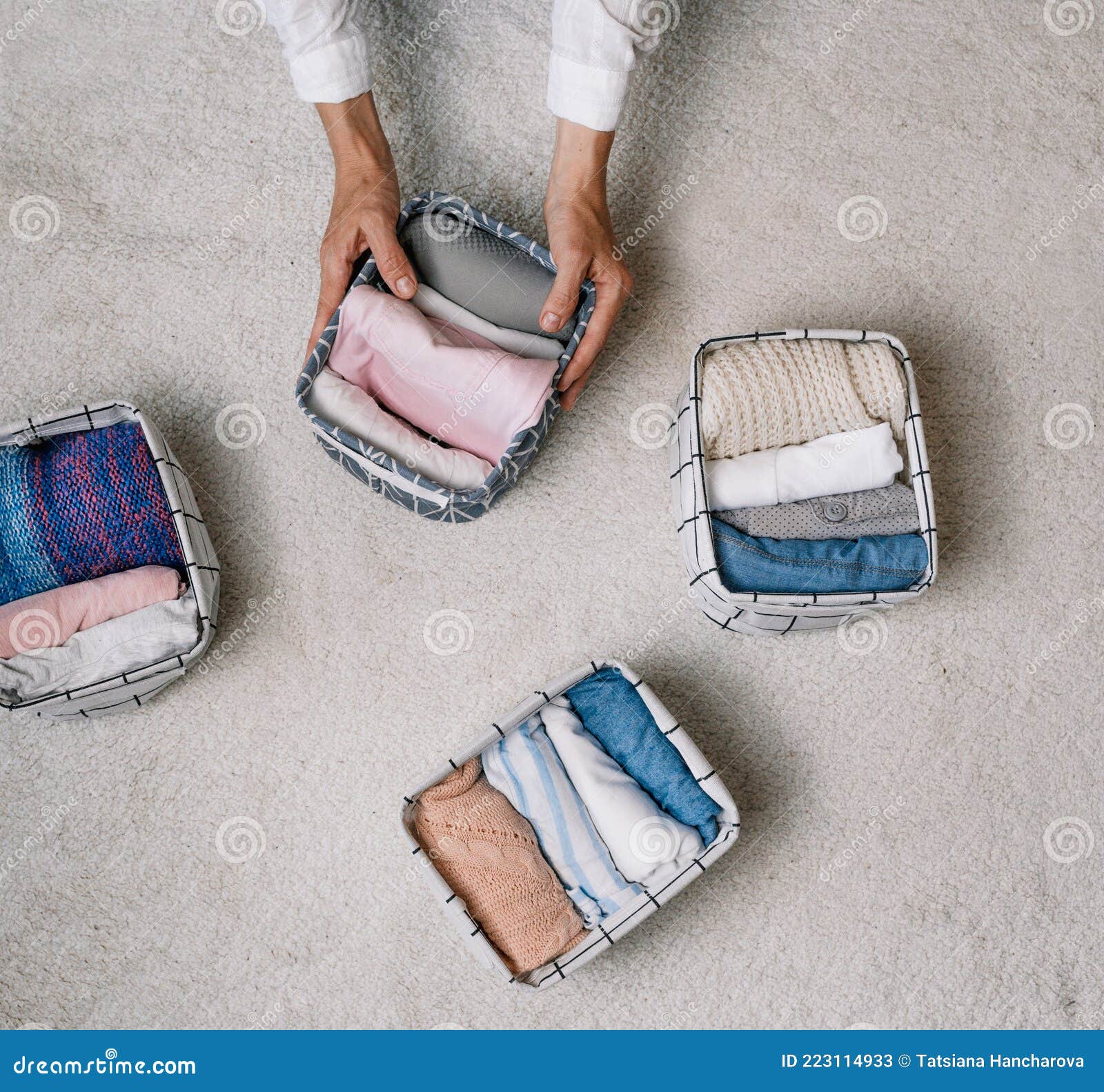 A Neat Housewife Puts Things in a Laundry Container during General ...