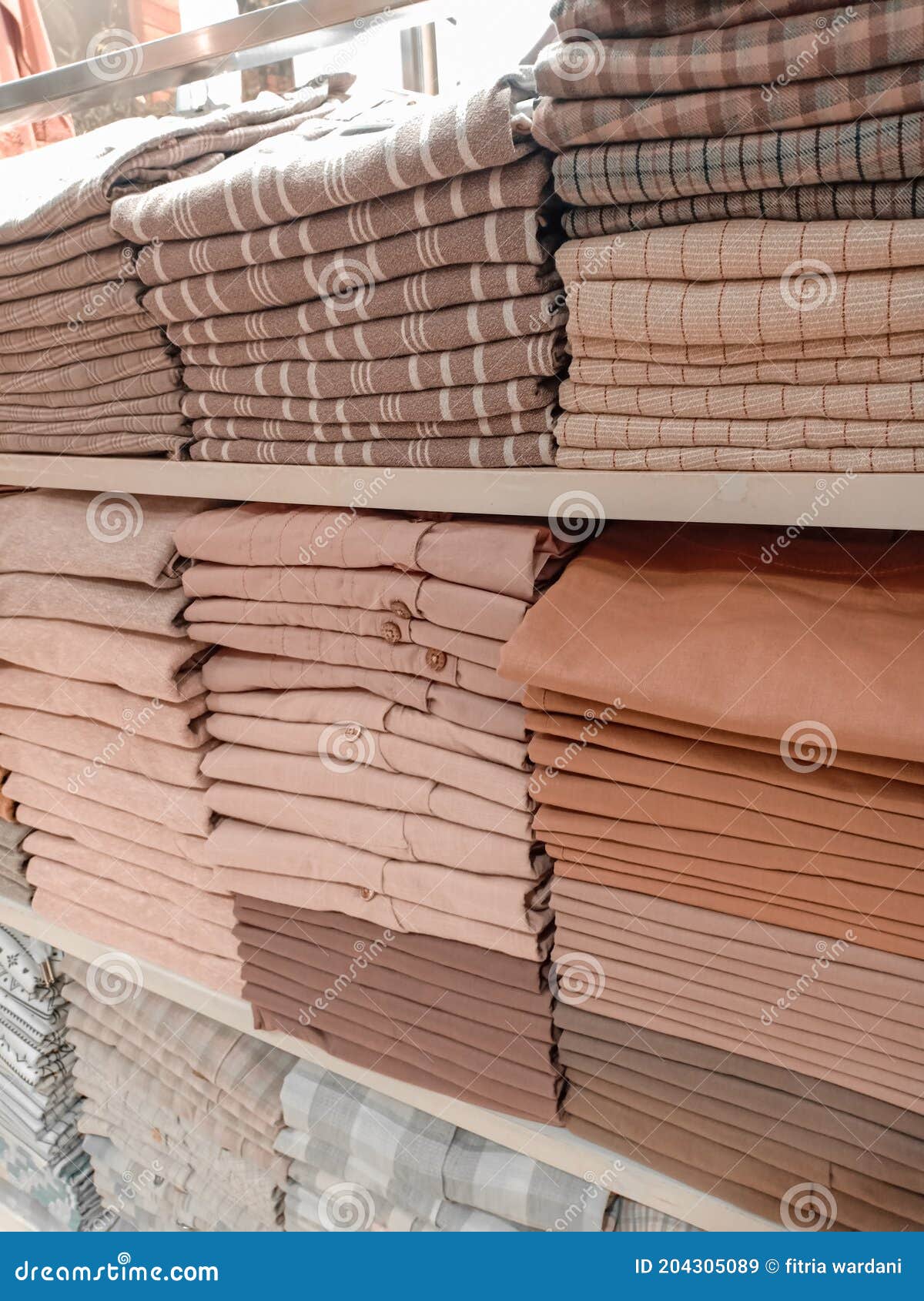 Neat rows of clothes stock image. Image of flooring - 204305089