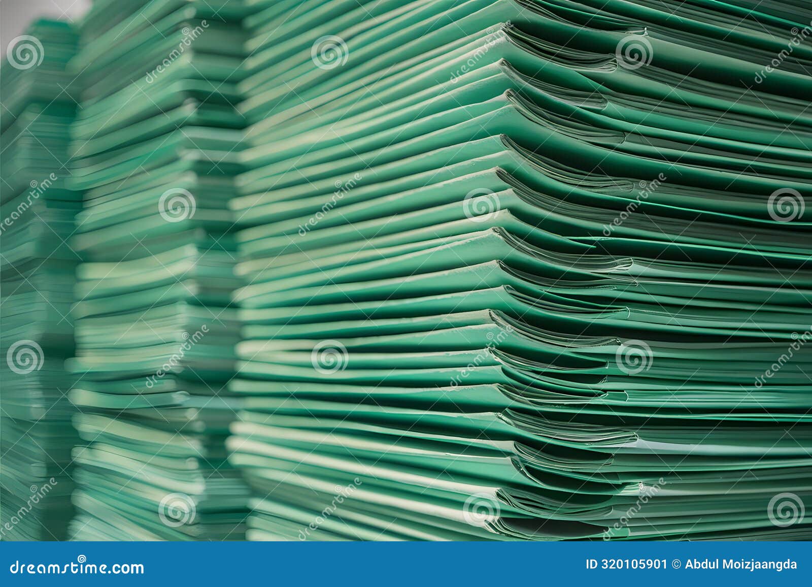 Neat Stack of Green Papers with Curled Edges, Blurred Background Stock ...