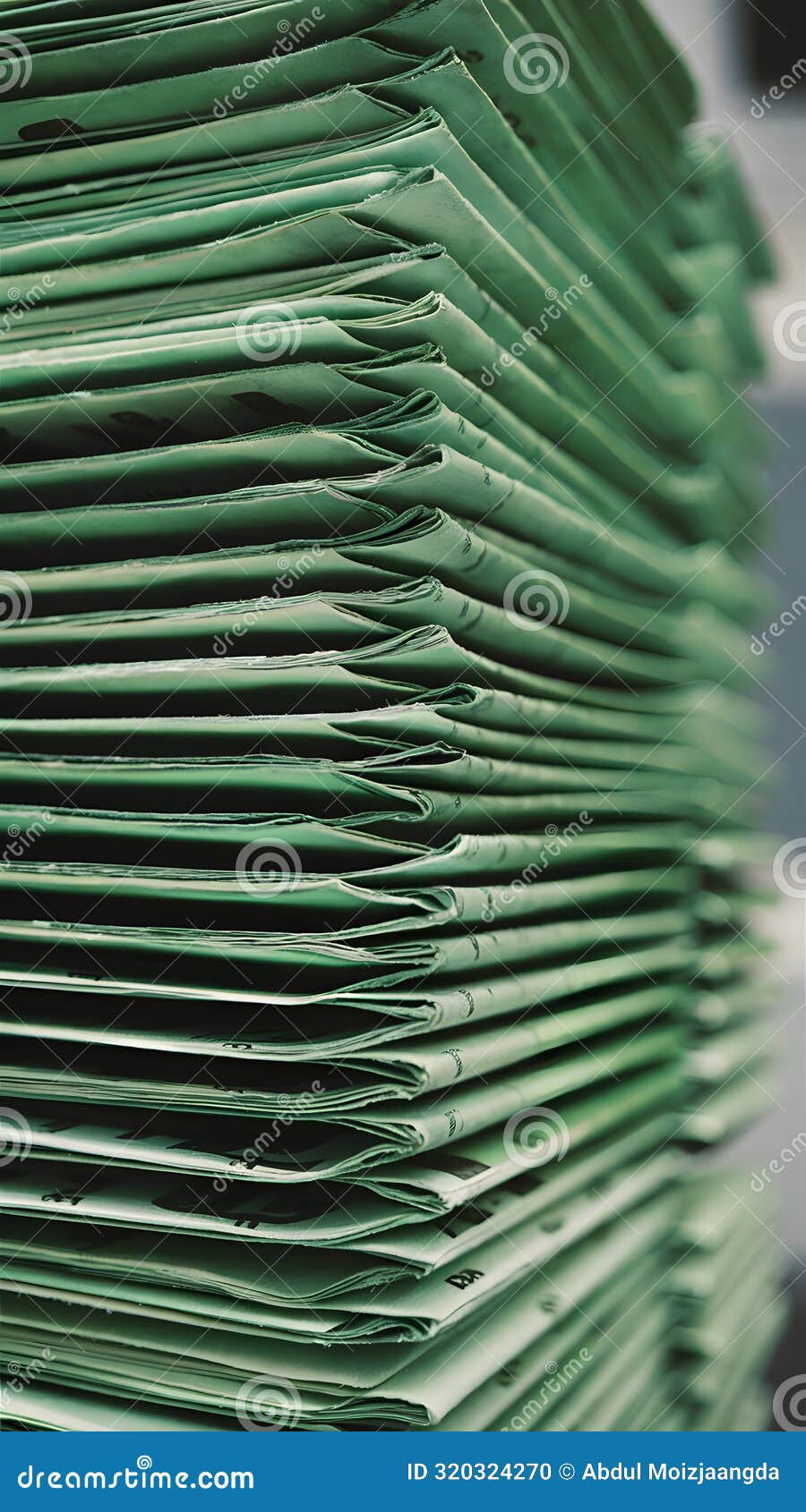 Neat Stack of Green Papers with Curled Edges, Blurred Background Stock ...